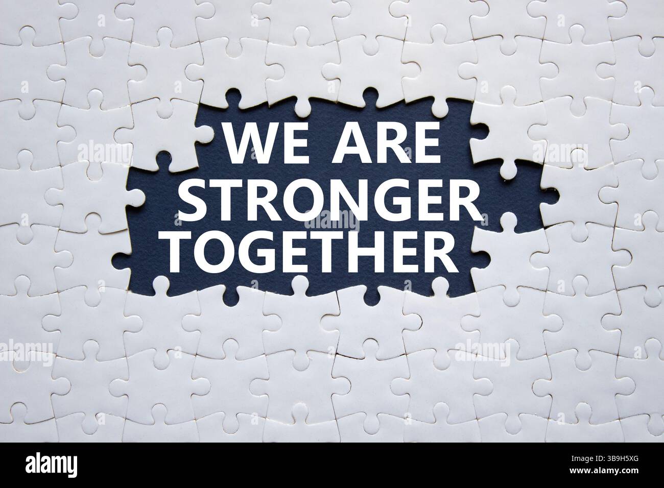 We are stronger together symbol. White puzzle with words We are ...