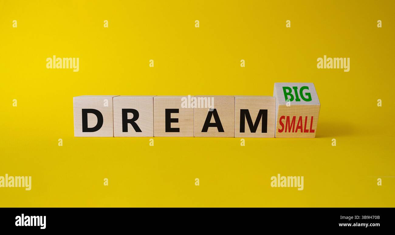 Dream Big vs Small symbol. Wooden cubes with words Dream Small and ...