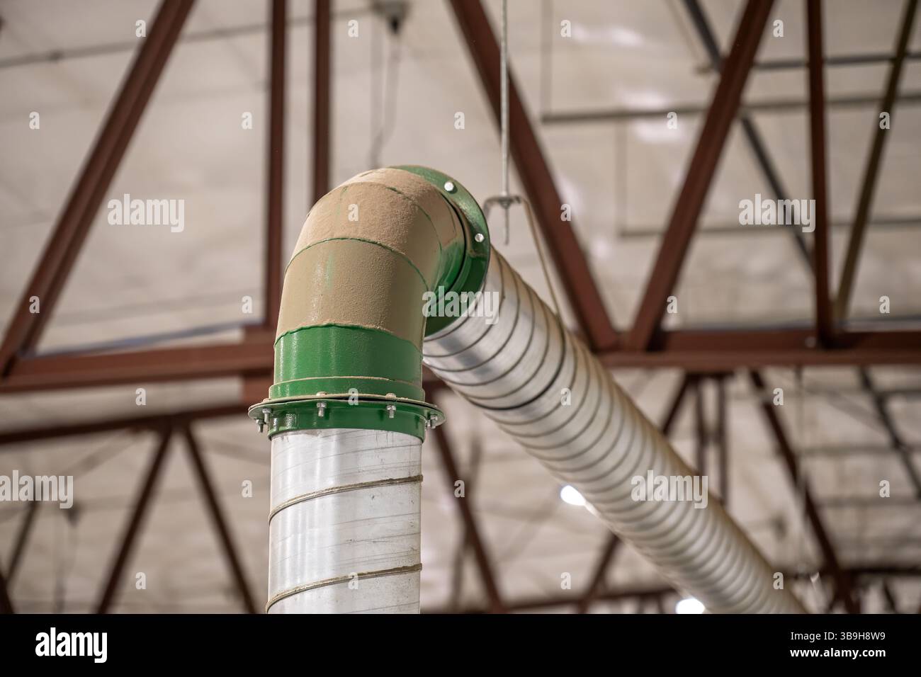 Industrial HVAC metal piping in a production facility with a coating of ...