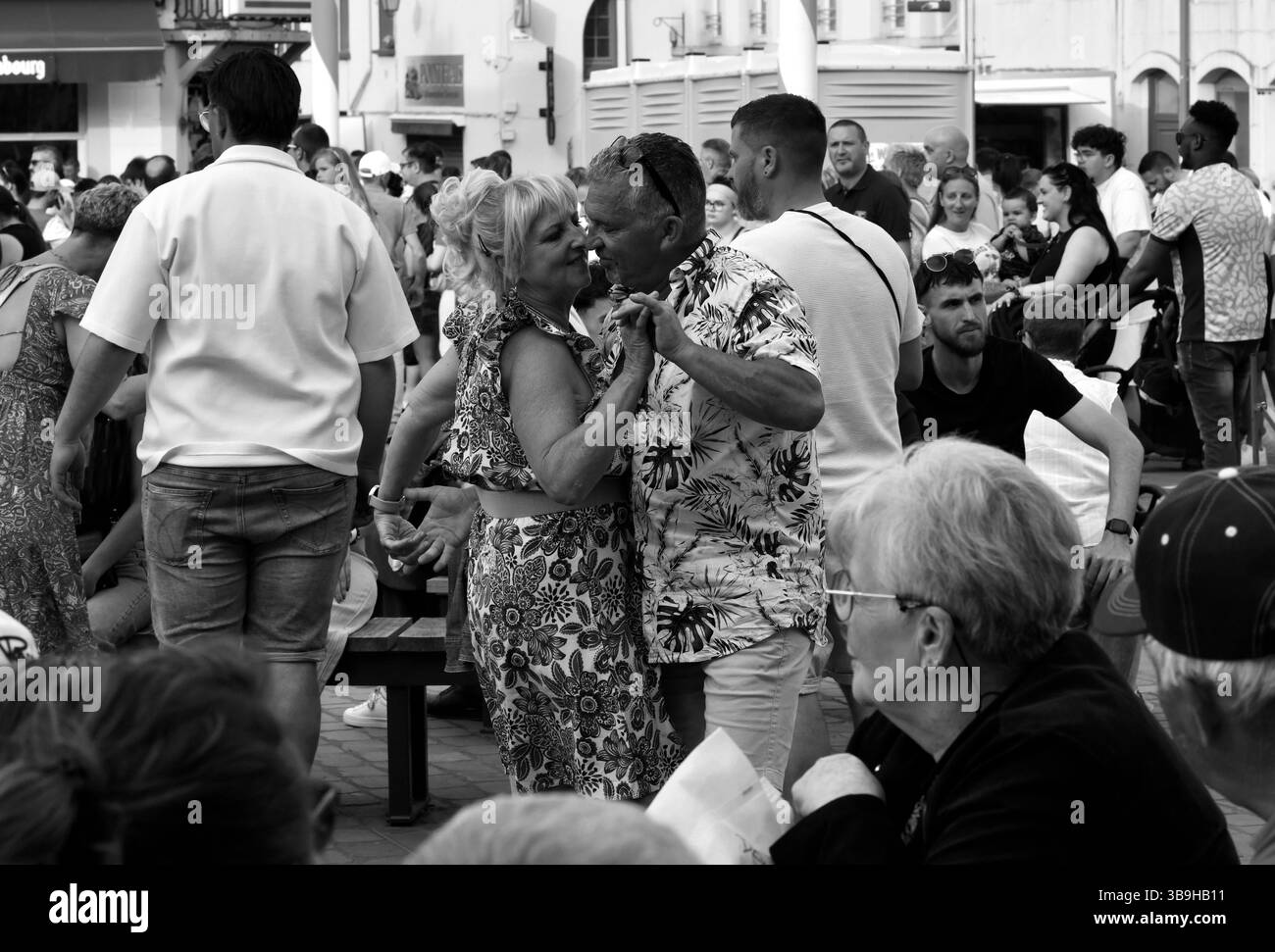 Couples dancing in the street during May Day La Fête du Muguet (Lilly ...