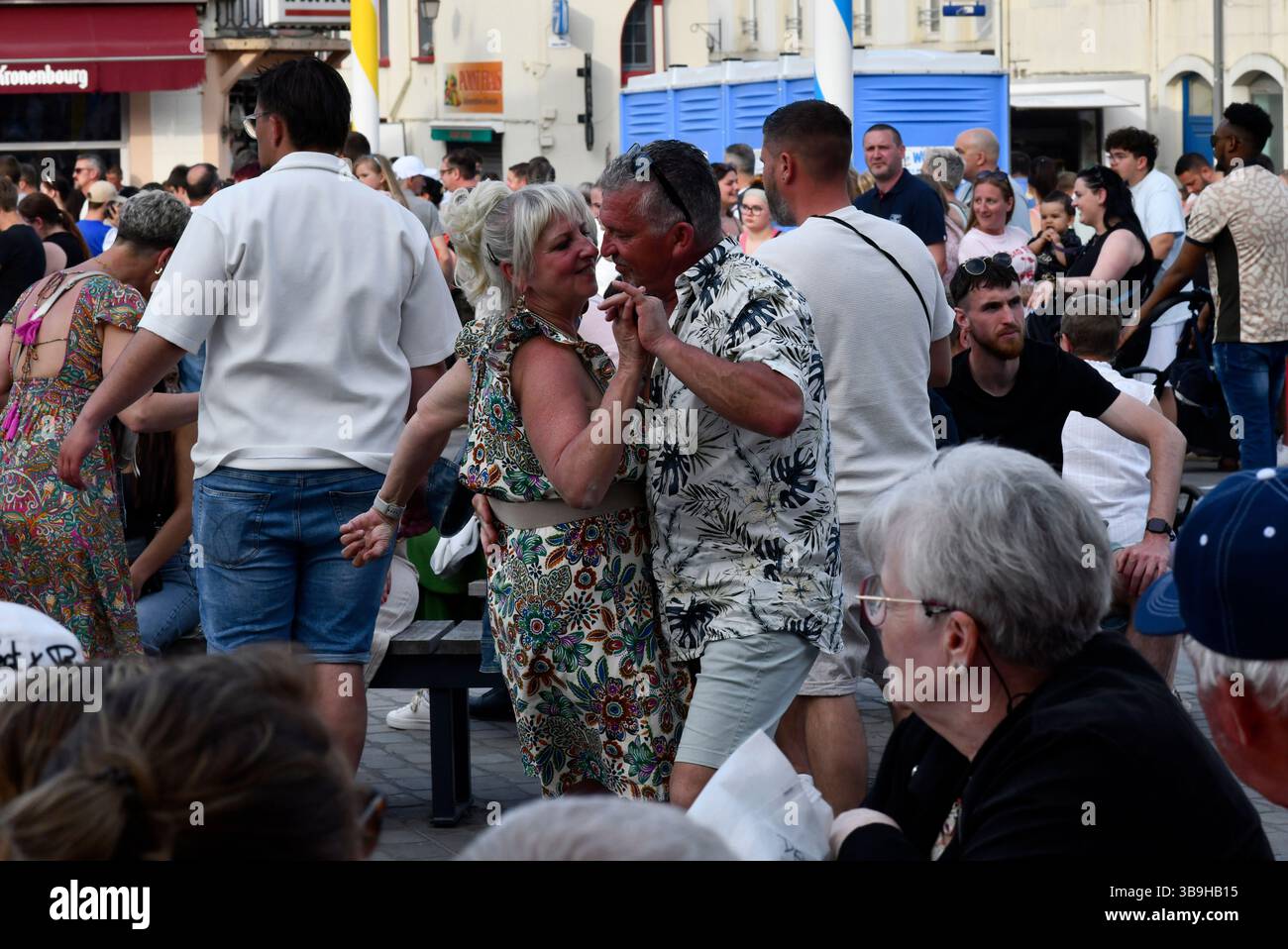 Couples dancing in the street during May Day La Fête du Muguet (Lilly ...