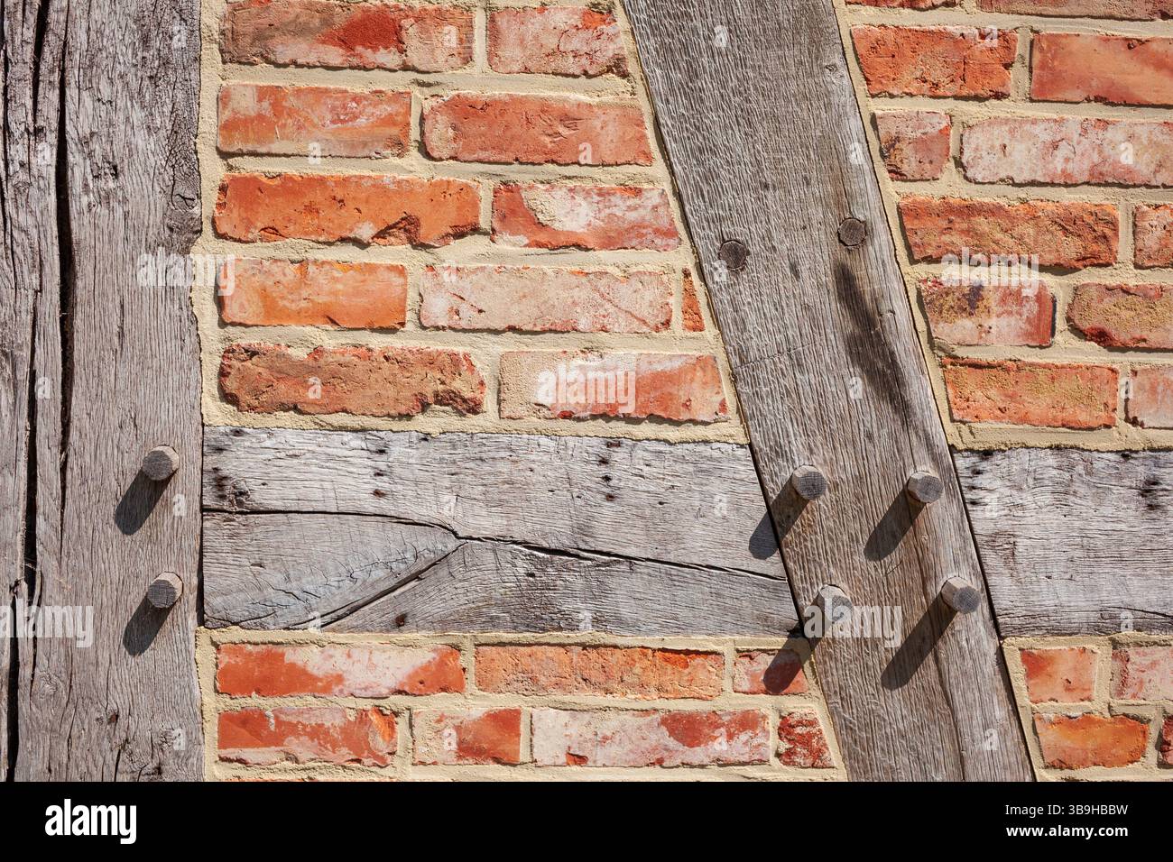 Brick wall with half-timbered beams, Achim, Lower Saxony, Germany Stock ...
