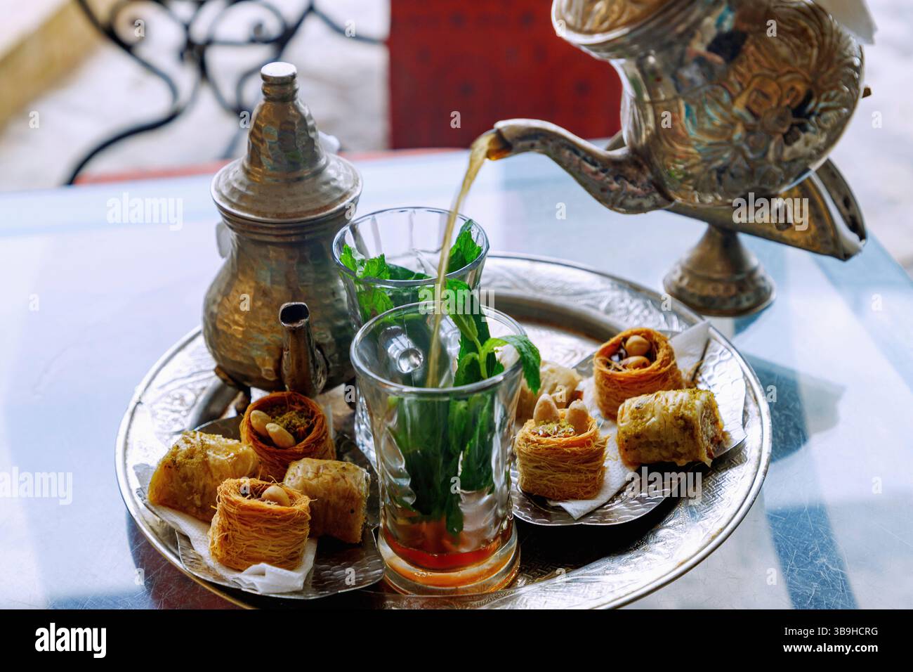 Arabic-style peppermint tea with four pieces of Hlou, Tunisian ...