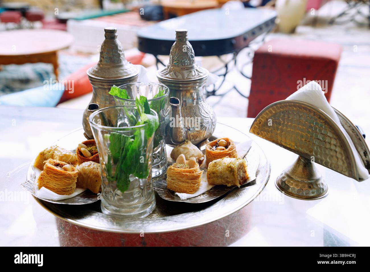 Arabic-style peppermint tea with four pieces of Hlou, Tunisian ...