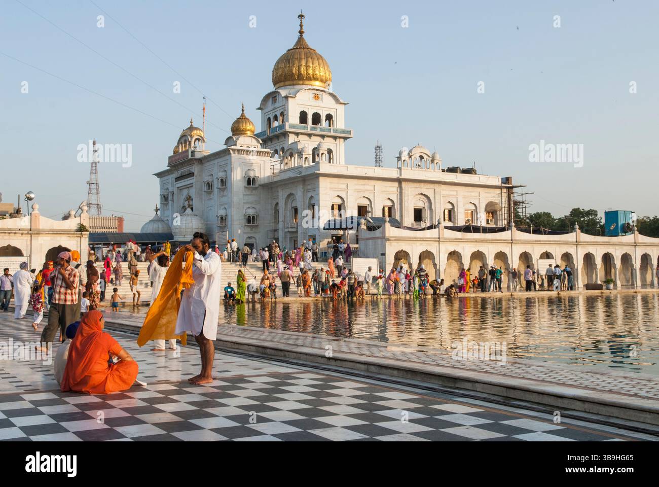 Followers by the " Sarovar" pond whose water is considered holy, inside ...