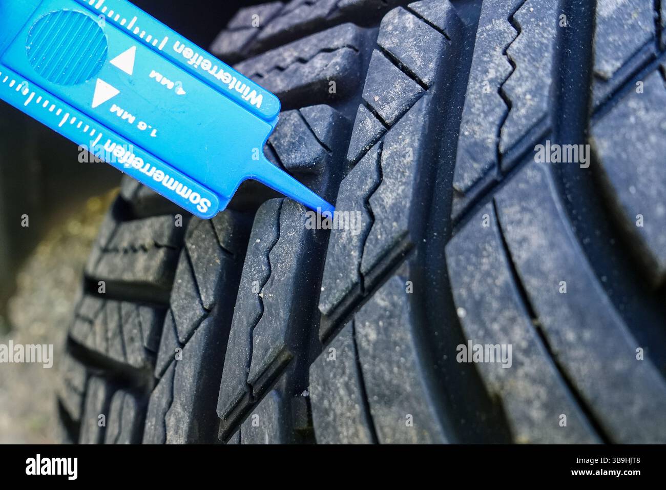 A blue tire tread depth gauge for measuring the tire tread Stock Photo ...