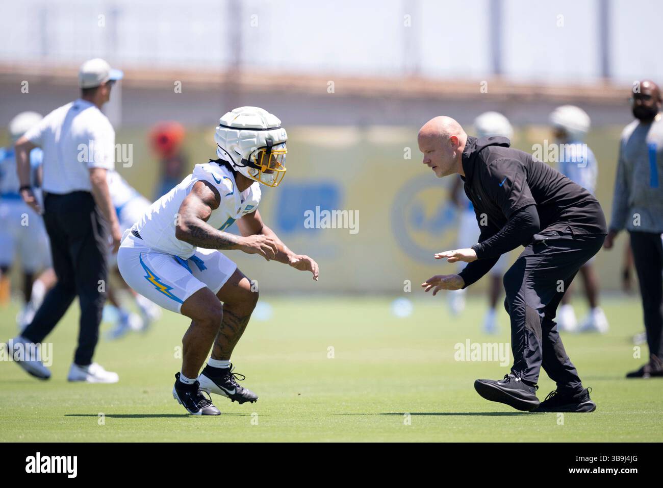 Los Angeles Chargers running back Omarion Hampton, front left, drills ...