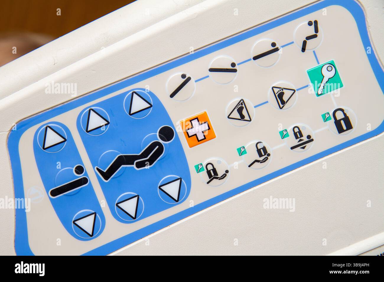 A white and blue device with a lot of buttons from a hospital bed Stock ...