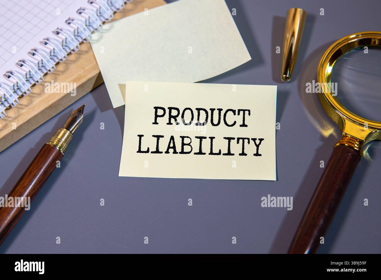 Product liability message written on white paper with blurry lake ...