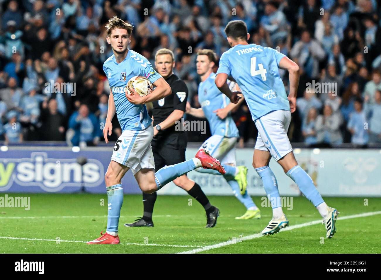 Jack Rudoni (5 Coventry City) runs back to half way line after ...