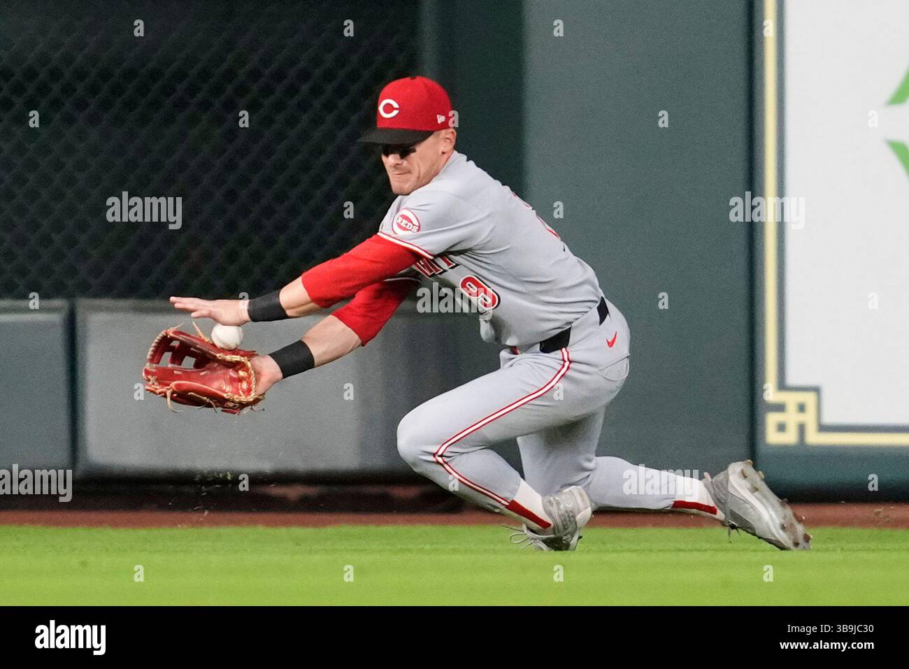 Cincinnati Reds' TJ Friedl fields a fly ball hit by Houston Astros ...