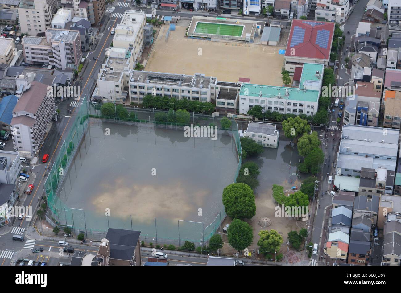 An aerial photo shows the flooded Higashi-Nakahama Park and Sports ...