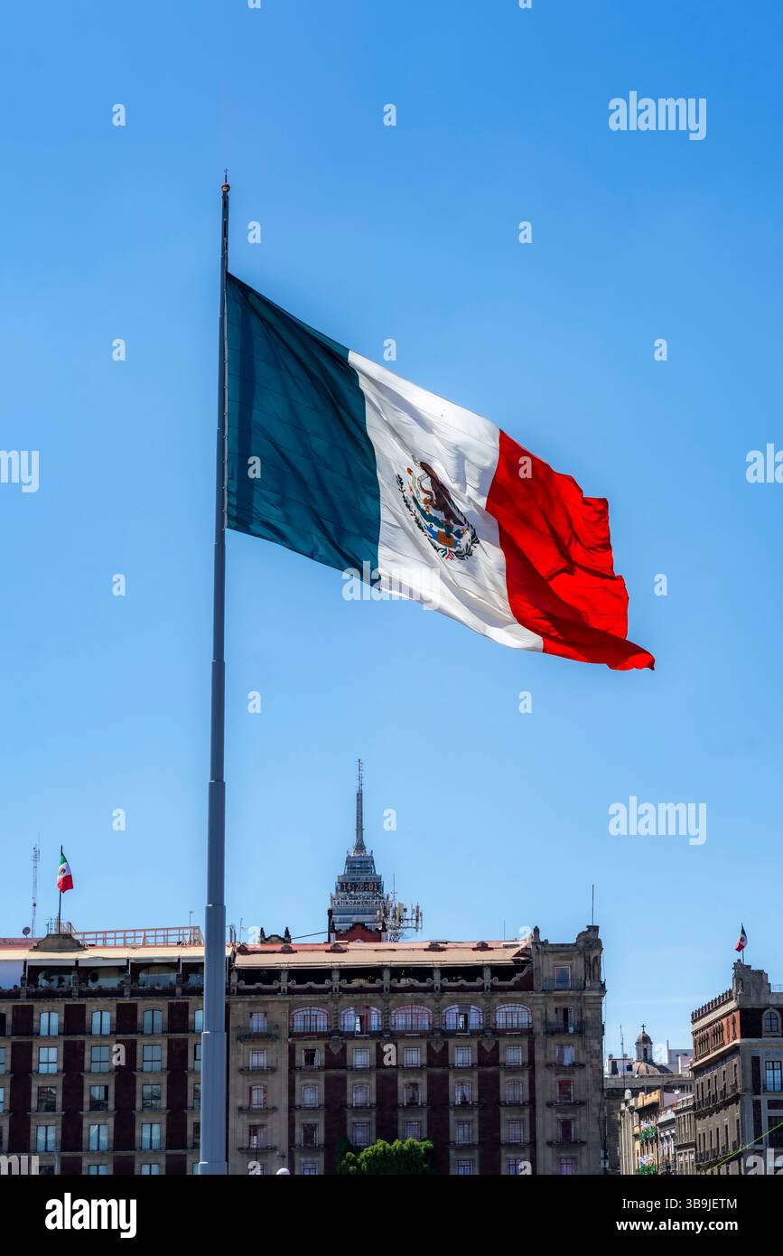 Midday photo of the giant Mexican flag waving at the Zocalo in Mexico ...