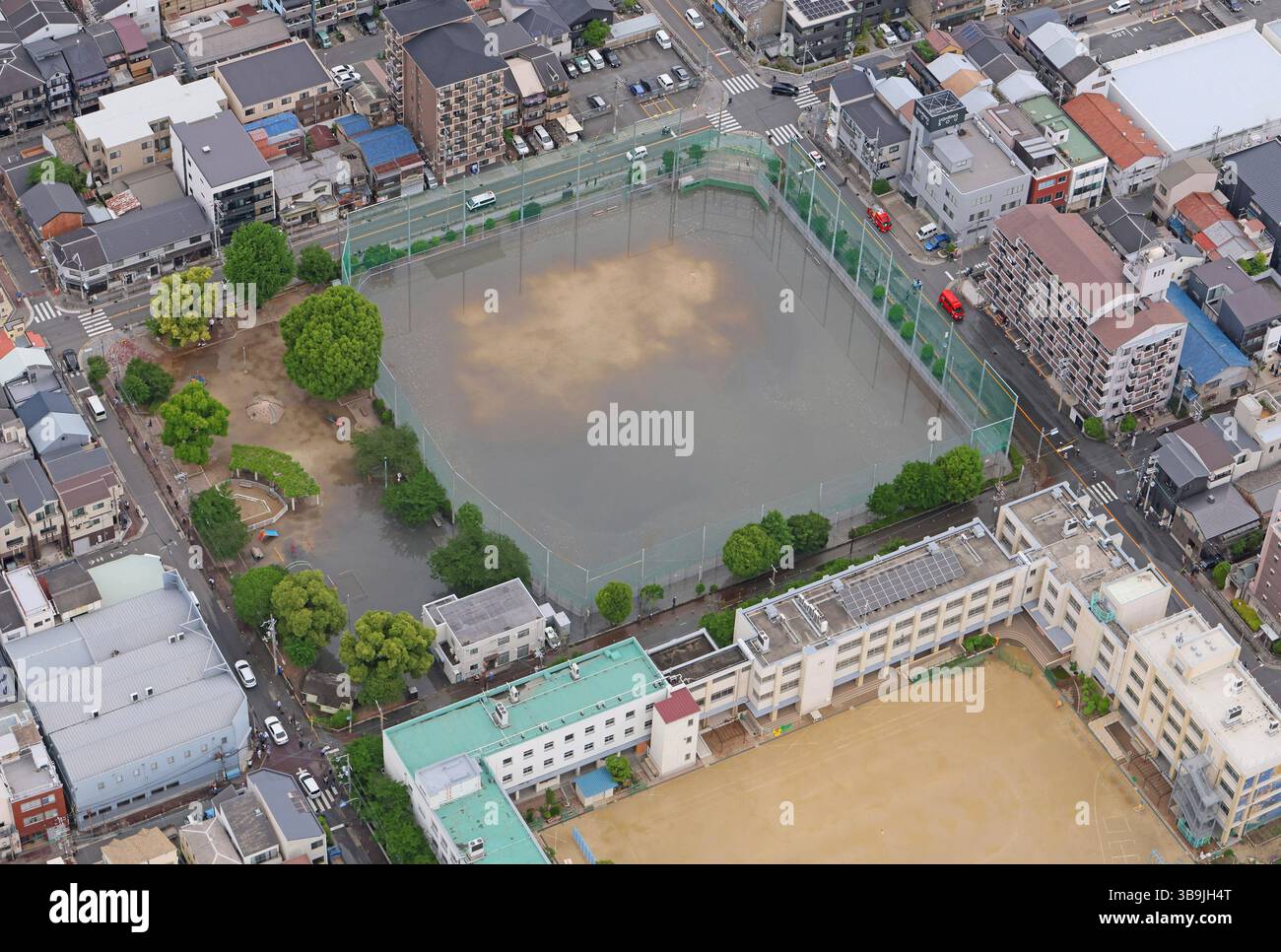 An aerial photo shows the flooded Higashi-Nakahama Park and Sports ...