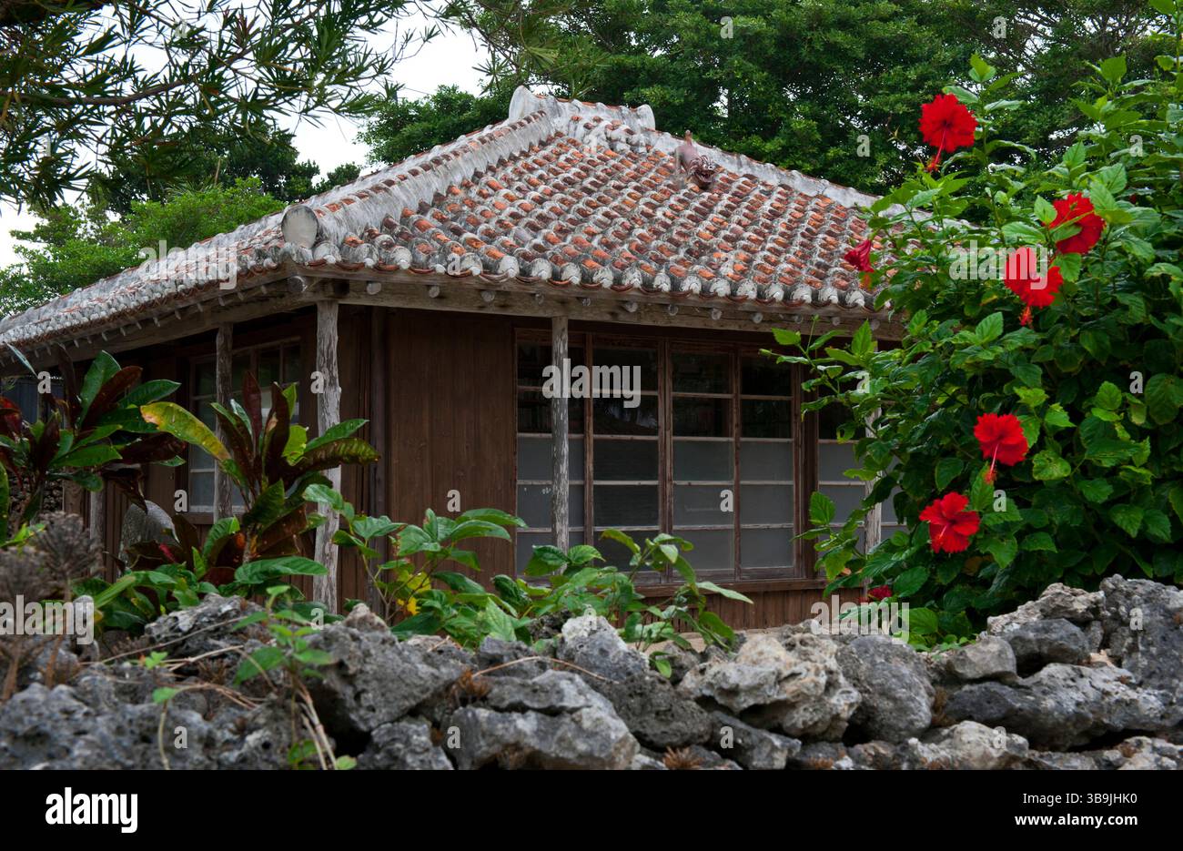 Typical single-story, single-family residence on Taketomi Island with ...