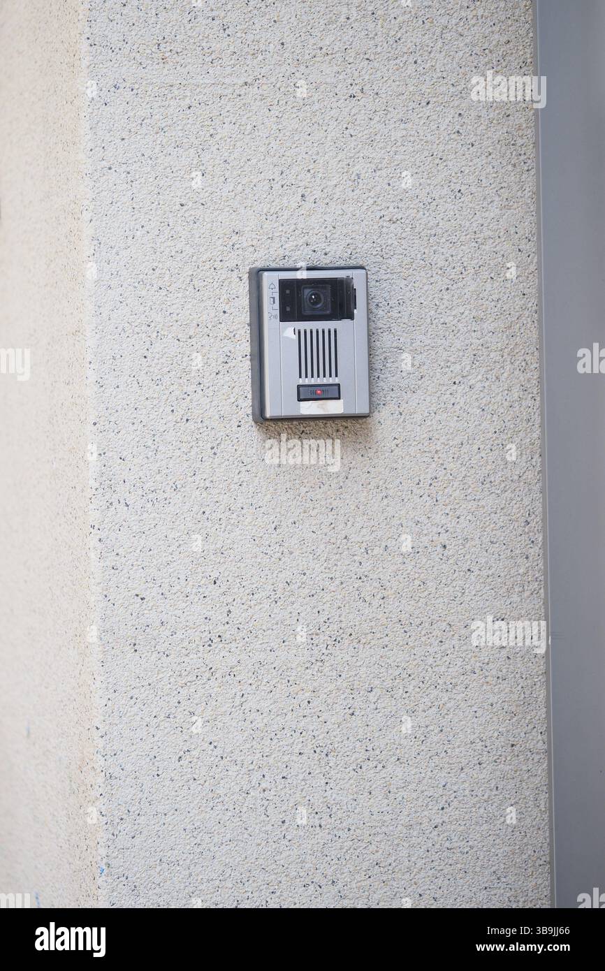 Security intercom installed on a textured wall outdoors Stock Photo - Alamy