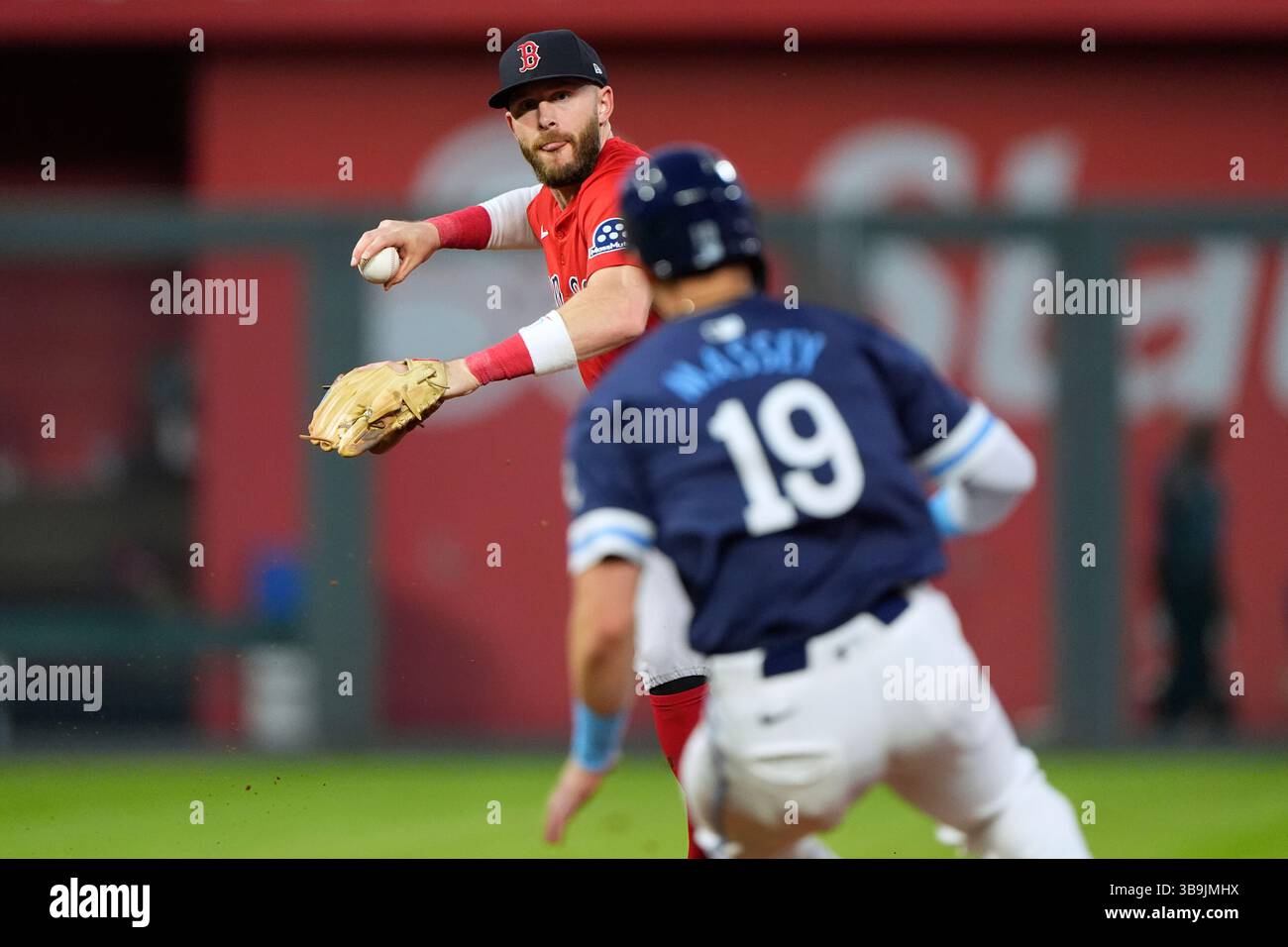Boston Red Sox shortstop Trevor Story throws to first for the double ...