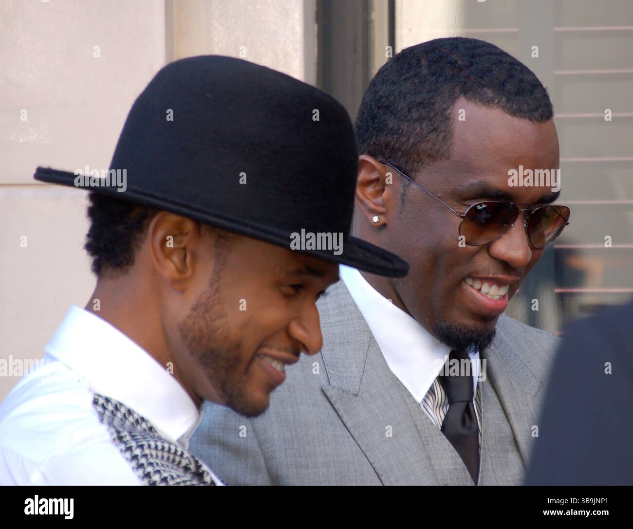 R&B artist Usher and hip hop mogul Sean “Diddy” Combs pose together at Kenneth “Babyface ...