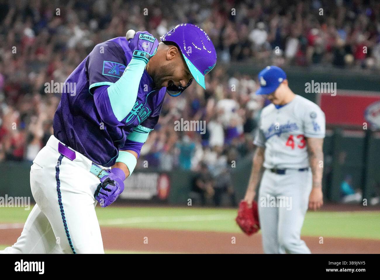 Arizona Diamondbacks outfielder Lourdes Gurriel Jr., left, pumps is ...