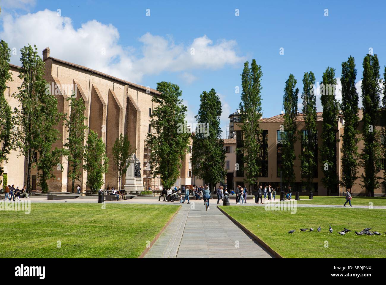 Parma Italy Pilotta Palace public garden people relaxing green lawn ...
