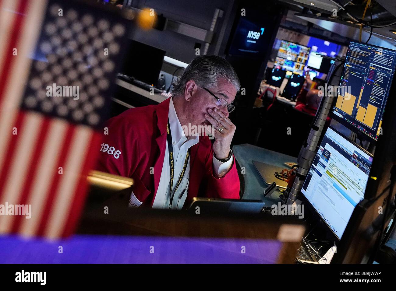 FILE - Trader Daniel Kryger works on the floor of the New York Stock ...