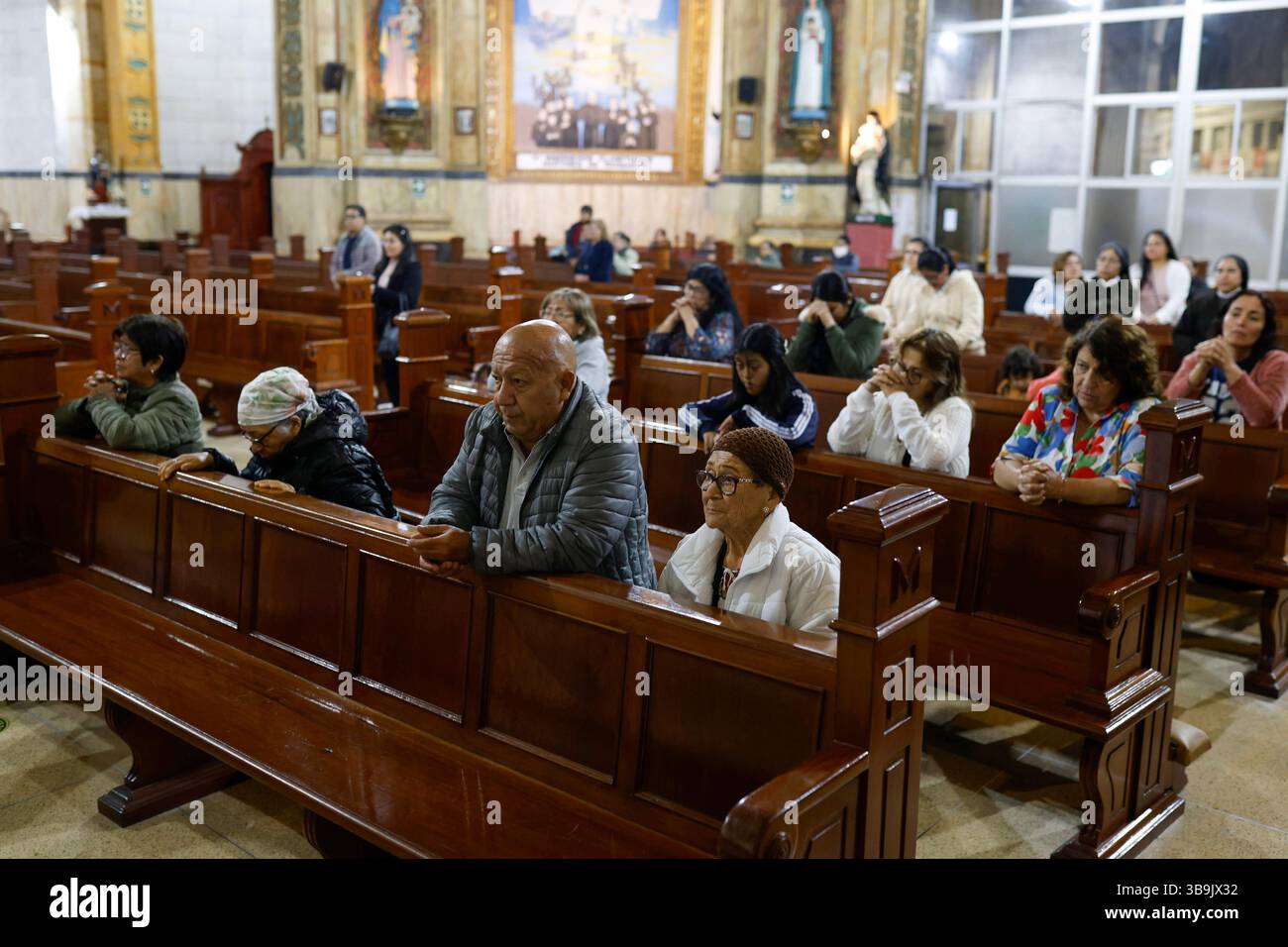 Lima, Lima, Peru. 9th May, 2025. A group of Catholic faithful pray ...