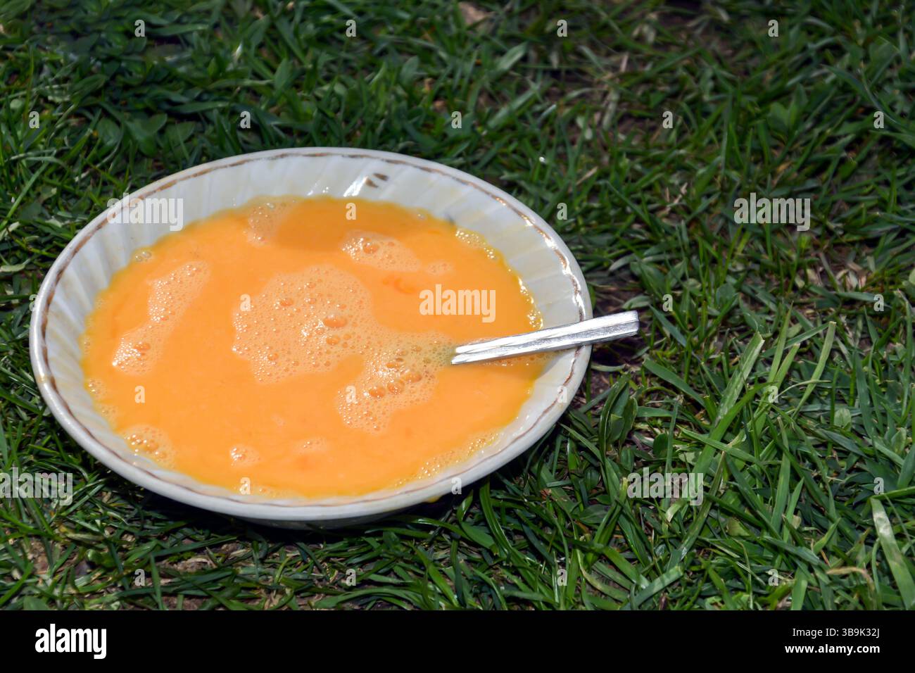 Egg yolk in a plate. Cooking scrambled eggs Stock Photo - Alamy