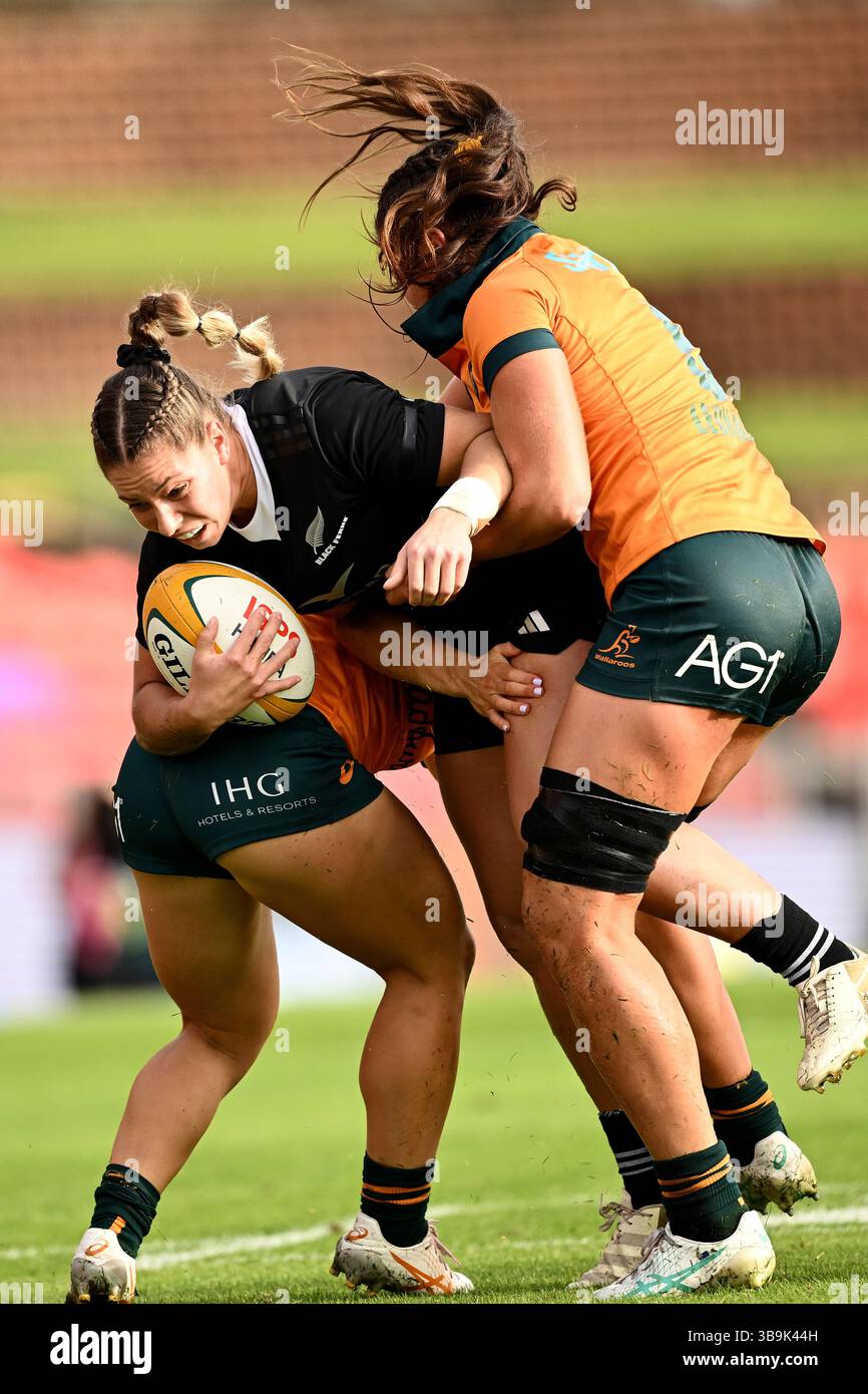 Newcastle, Australia. 10th May, 2025. Amy du Plessis of the Black Ferns is tackled by Desiree ...