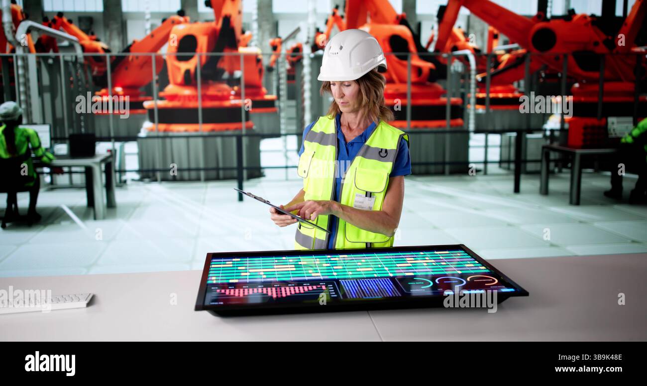 Female Engineer Operating Scada System At Industrial Plant With ...