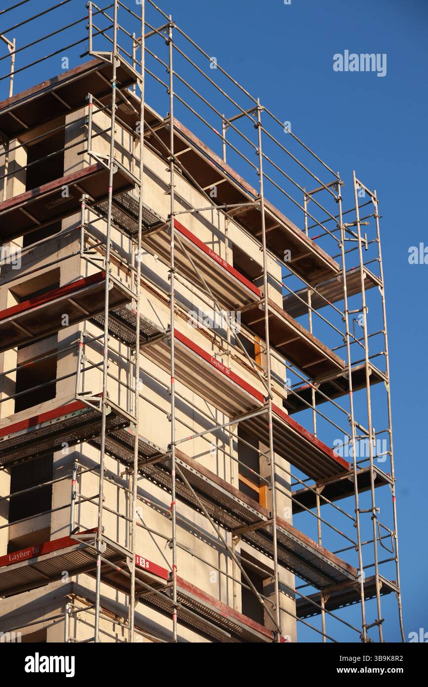 A building under construction with scaffolding on the side Stock Photo ...