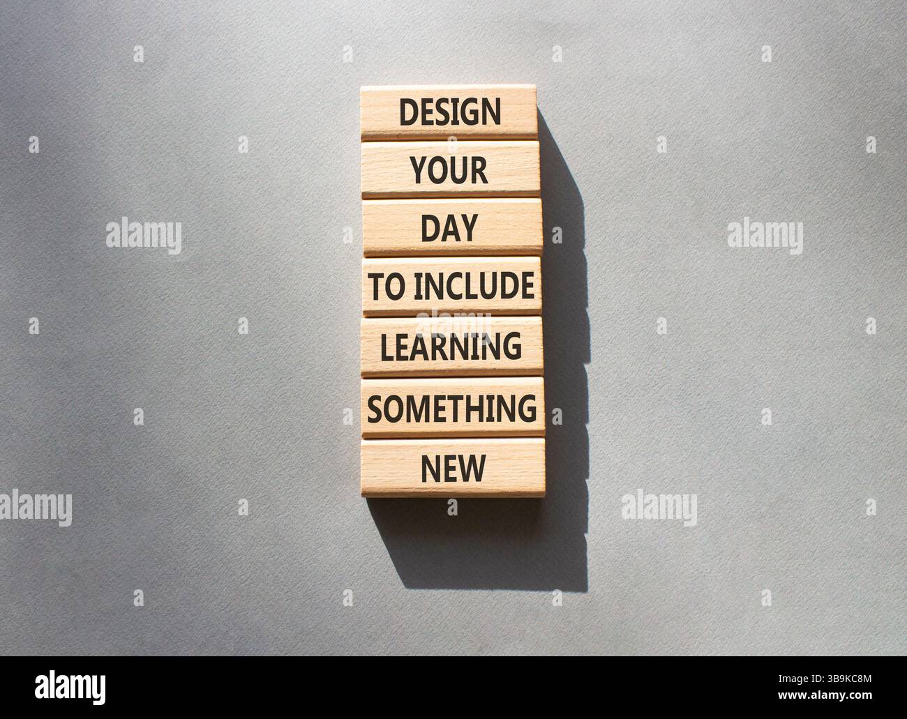 Learning symbol. Wooden blocks with words Design your day to learn ...