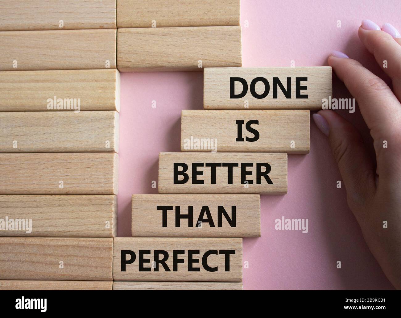 Done is better than Perfect symbol. Wooden blocks with words Done is ...