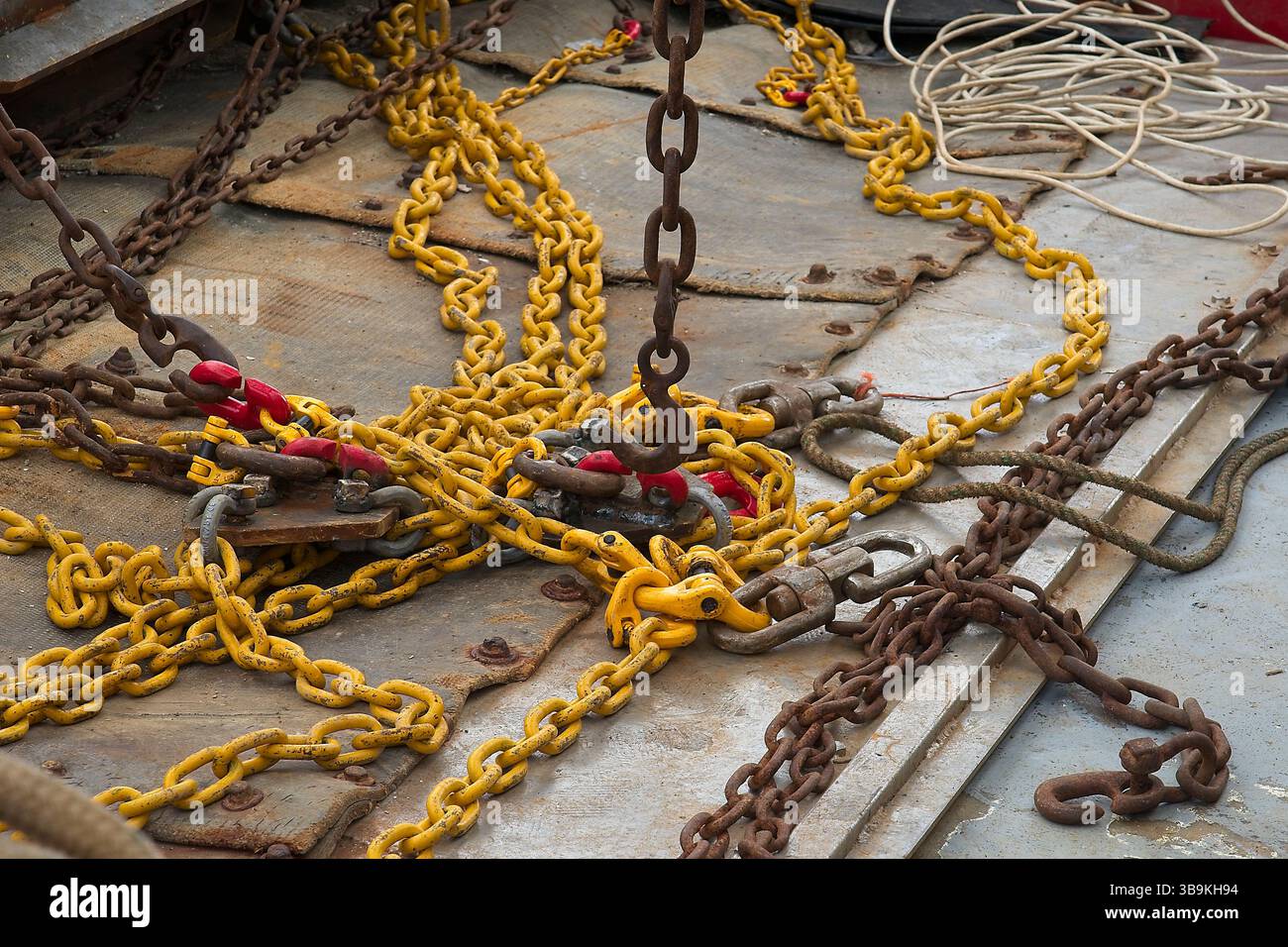 Colored chains intertwined on a fishing ship Stock Photo - Alamy
