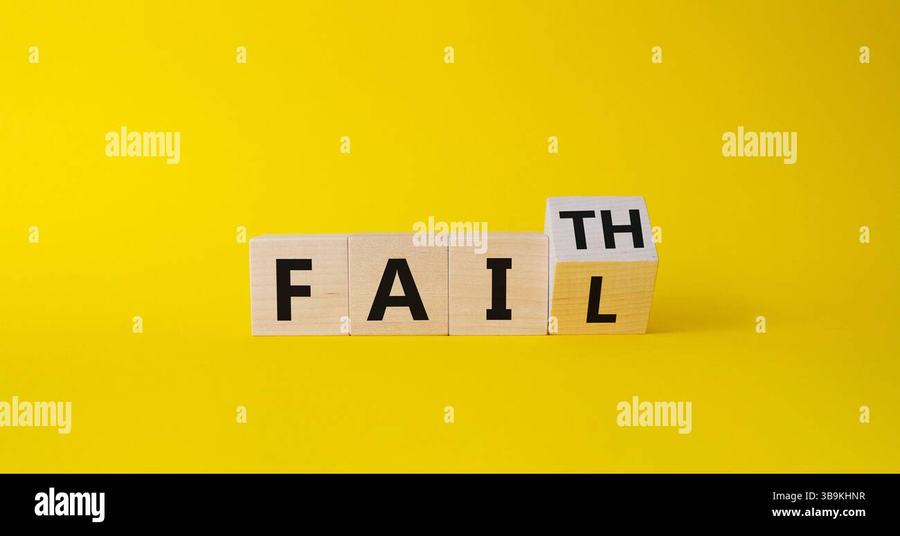Faith vs Fail symbol. Turned wooden cube with words Fail and Faith ...