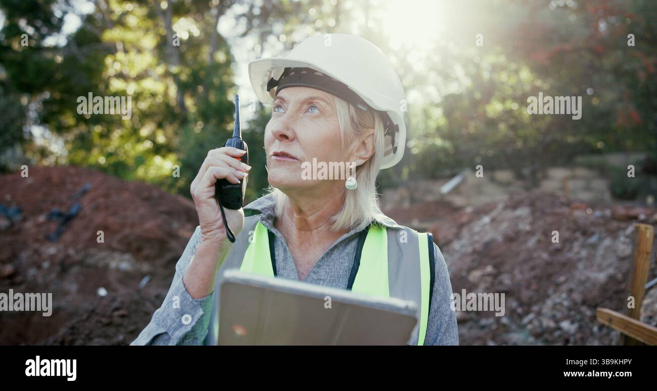 Building, radio and tablet with construction worker woman on excavation ...