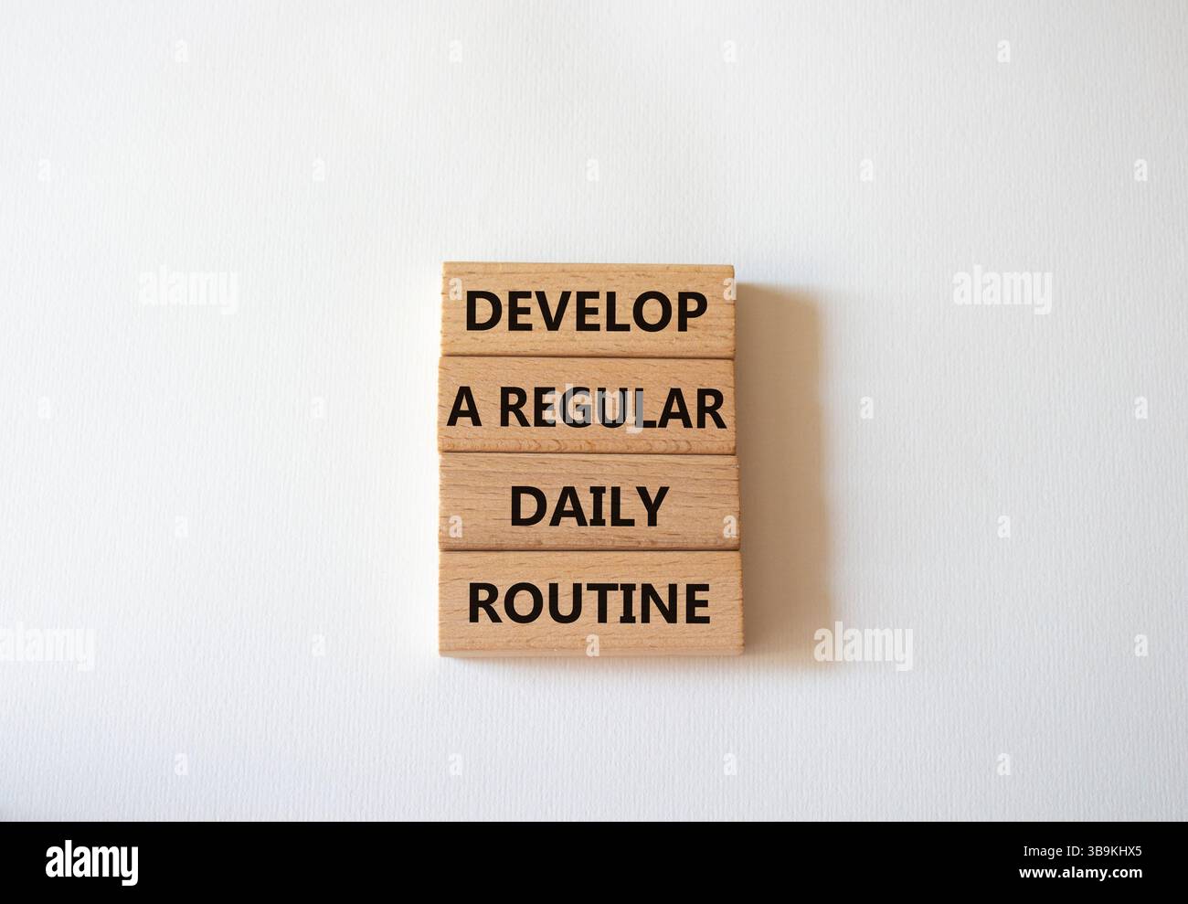 Develop a regular daily routine symbol. Concept words Develop a regular ...