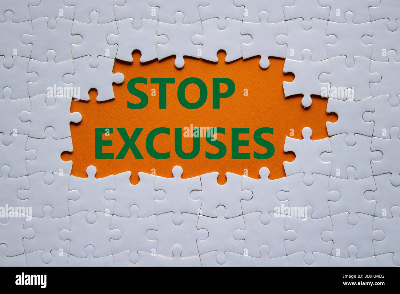 Stop excuses symbol. Concept words Stop excuses on white puzzle. Beautiful orange background ...