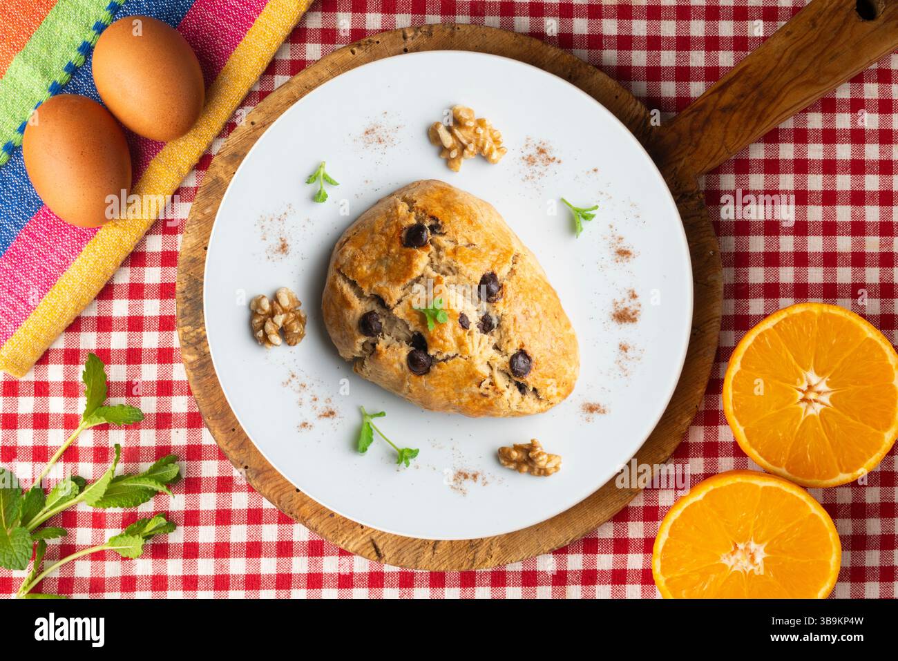 Triangular English scones with dark chocolate chips. Top view table ...