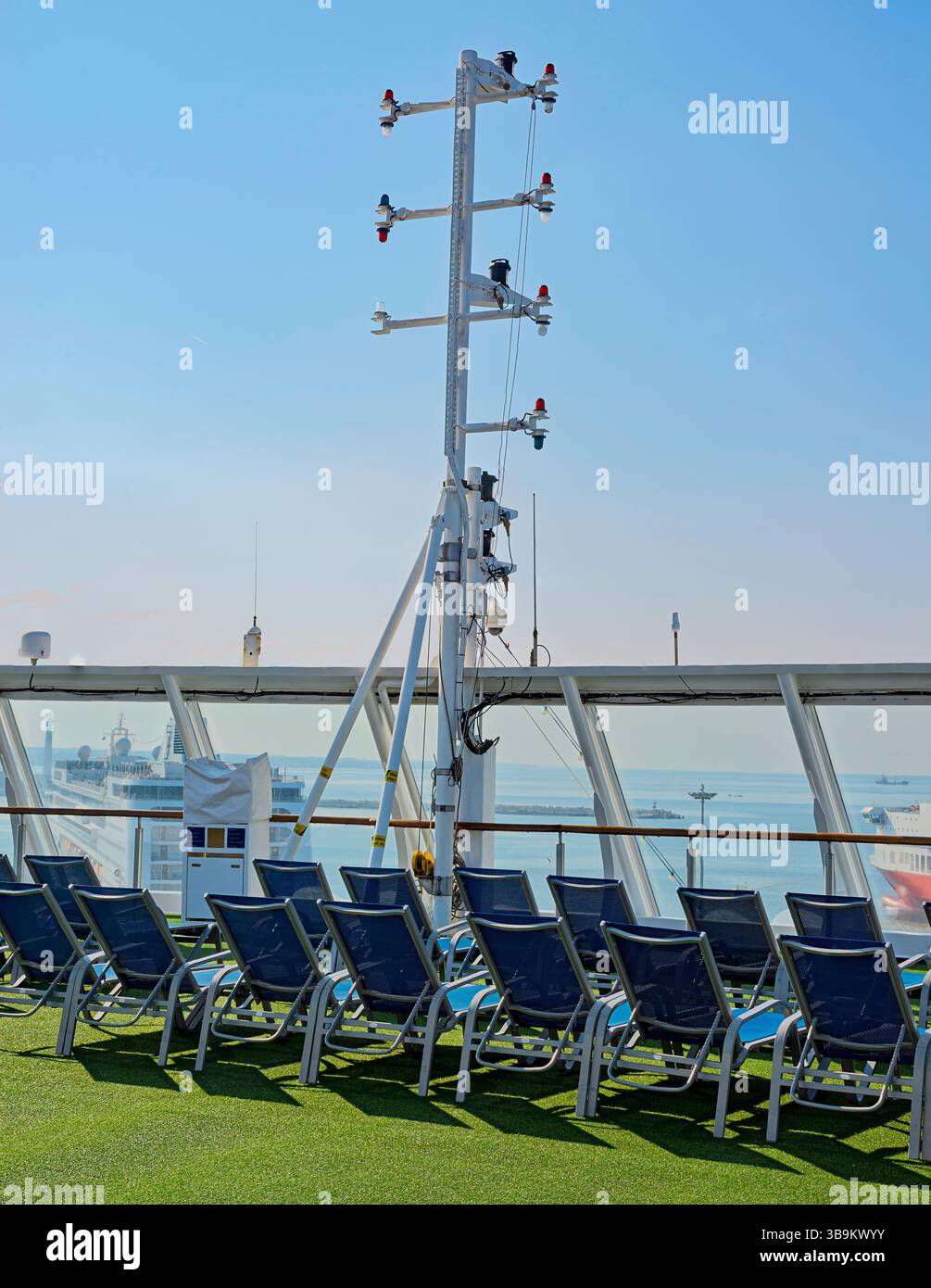 Relaxing cruise ship deck area with lounge chairs and modern spherical ...