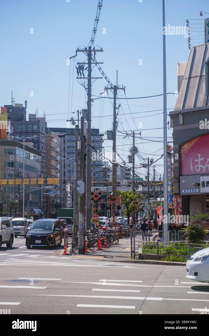 Osaka, Japan - May 3 2024: Osaka Street Scene with Traffic and Power ...
