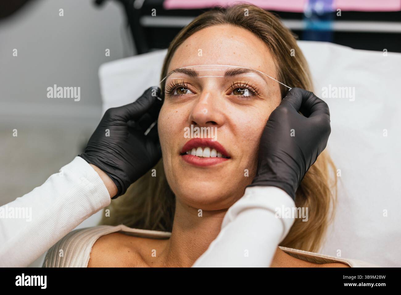 Professional aesthetician preparing client hi-res stock photography and ...