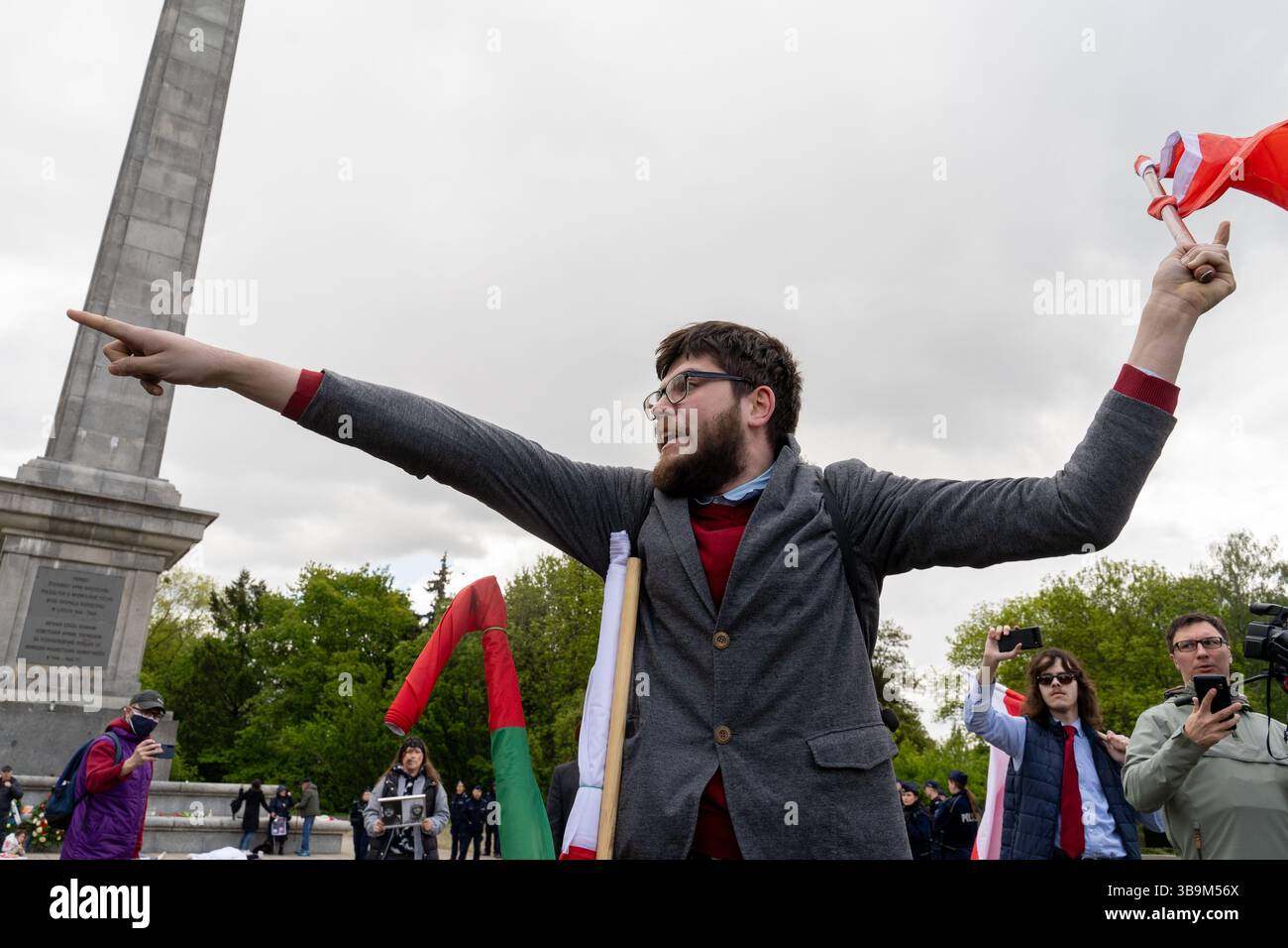 A man waves a Soviet Union flag as he takes part in the 80th ...