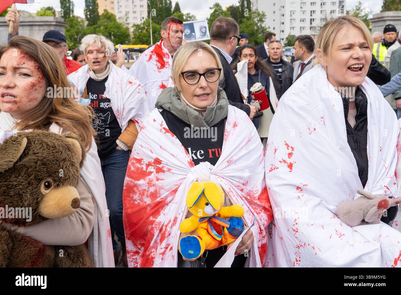 A Ukrainian activist takes part in a die-in protest at the Mausoleum ...