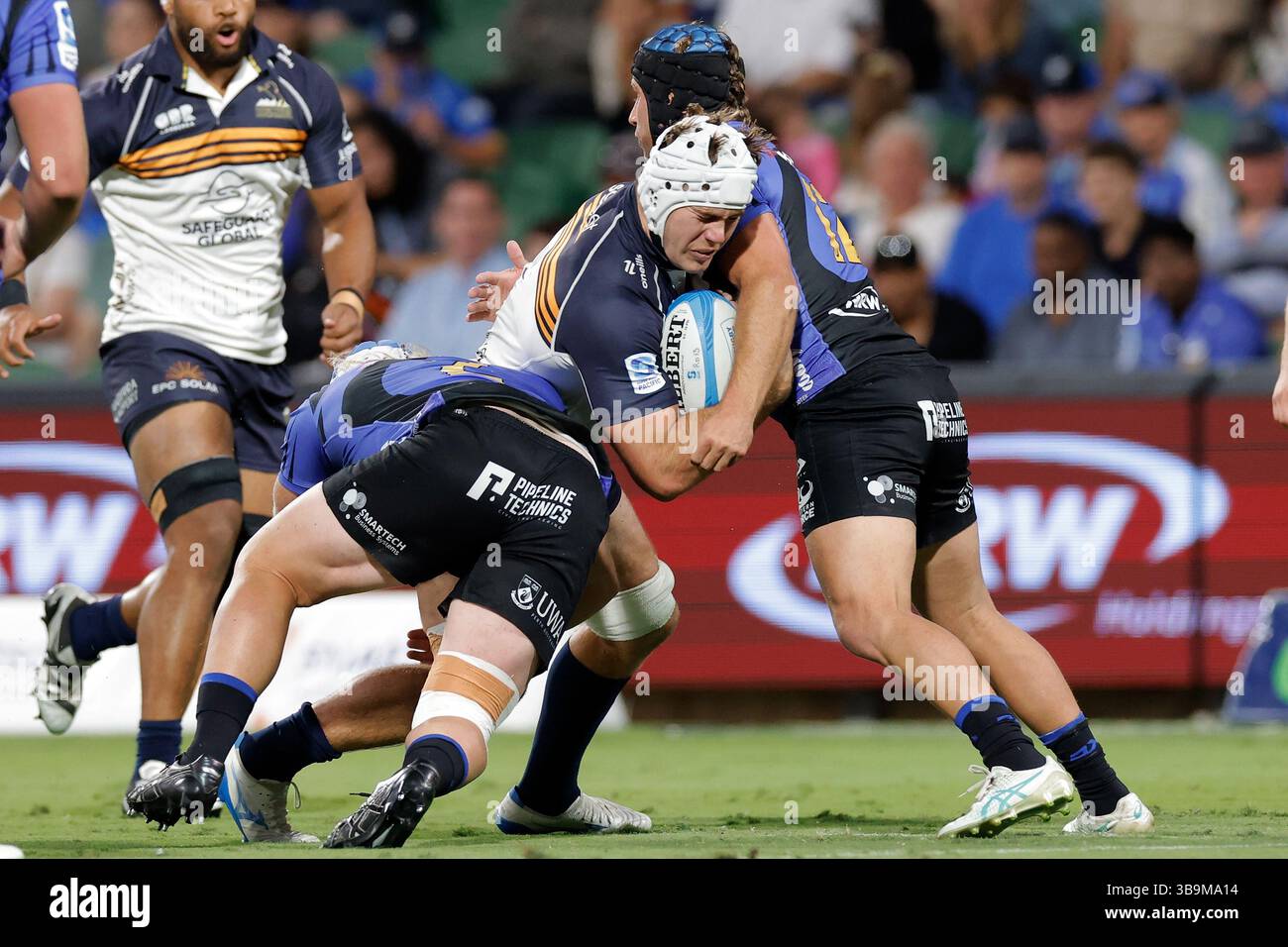 Perth, Australia. 10th May, 2025. Rory Scott of the Brumbies is tackled ...