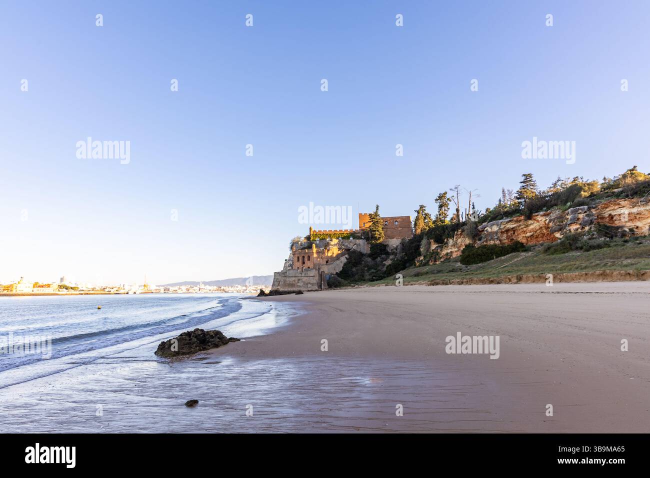 A castle in the middle of the beach. A historic building that protects the harbor. Castelo de ...