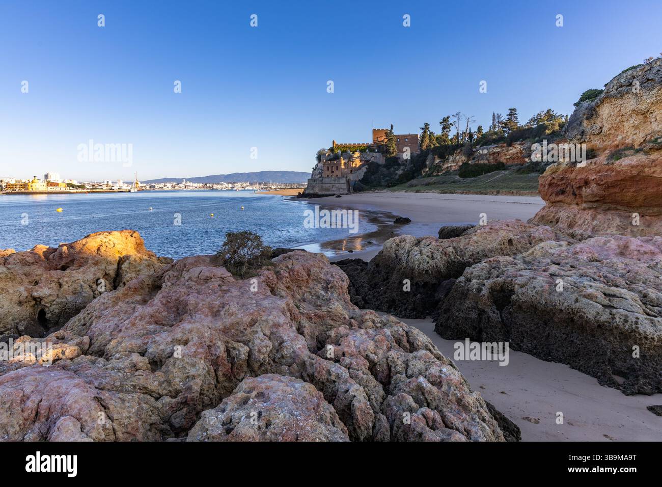 A castle in the middle of the beach. A historic building that protects the harbor. Castelo de ...