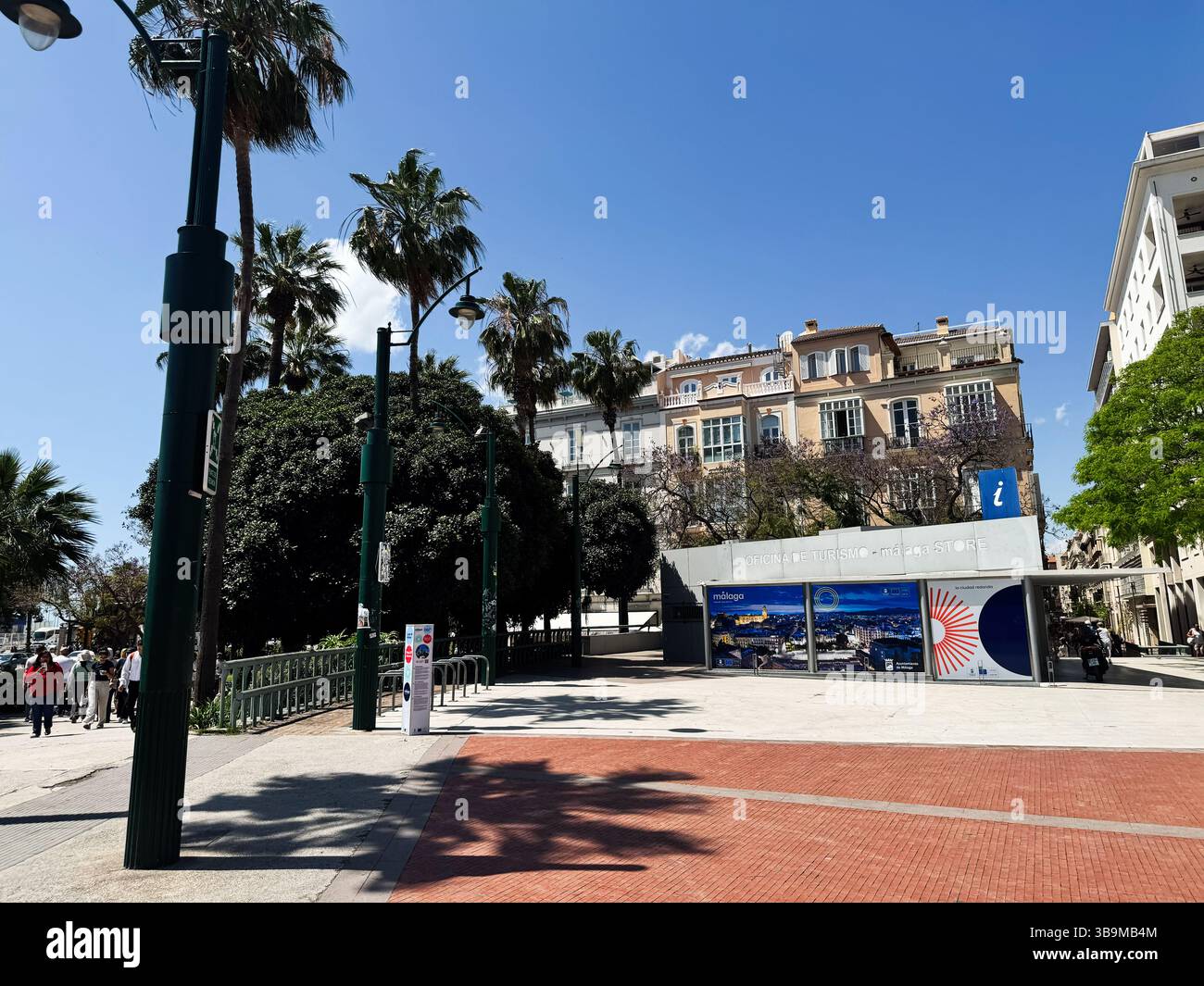 Malaga, Spain - May 02, 2025: Sunny street in Malaga, Spain with ...