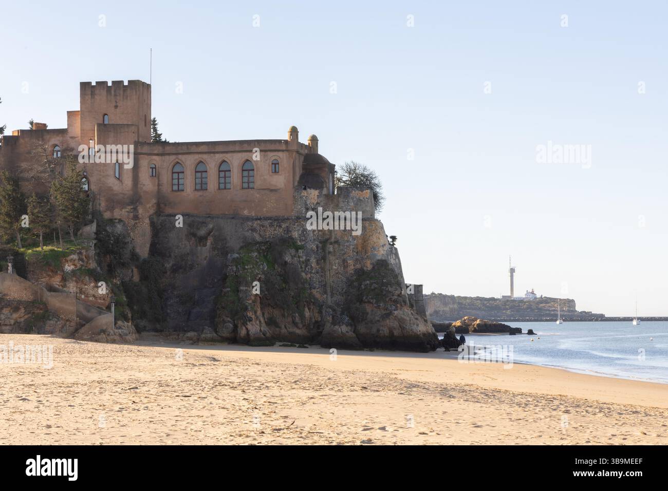 The Ferragudo Castle is located on a sandy beach in a harbor bay ...