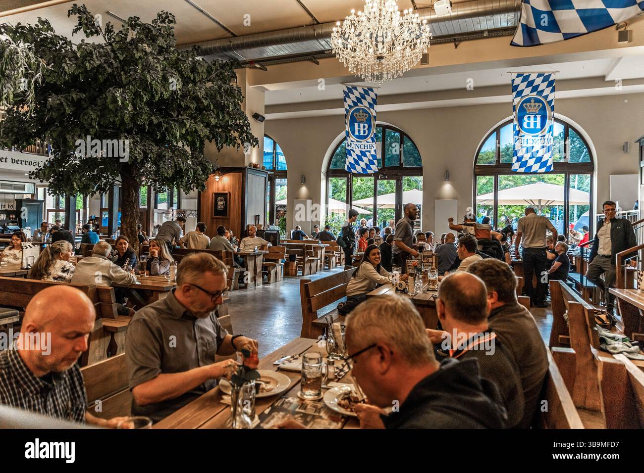 Hamburg, Germany - June 17, 2024: People enjoying drinks and food at ...