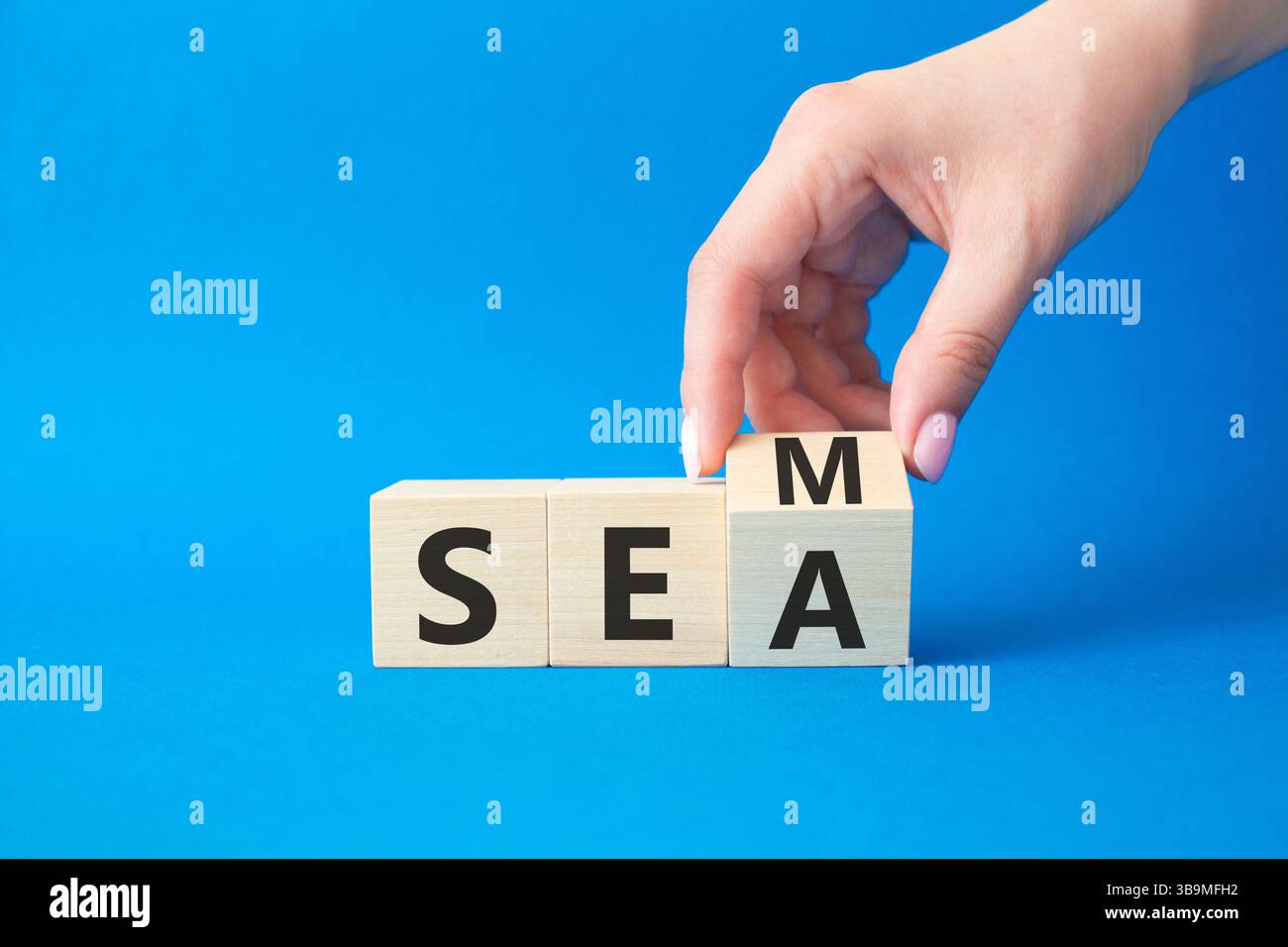 SEM vs SEA symbol. Businessman hand Turnes cube and changes word SEA to ...